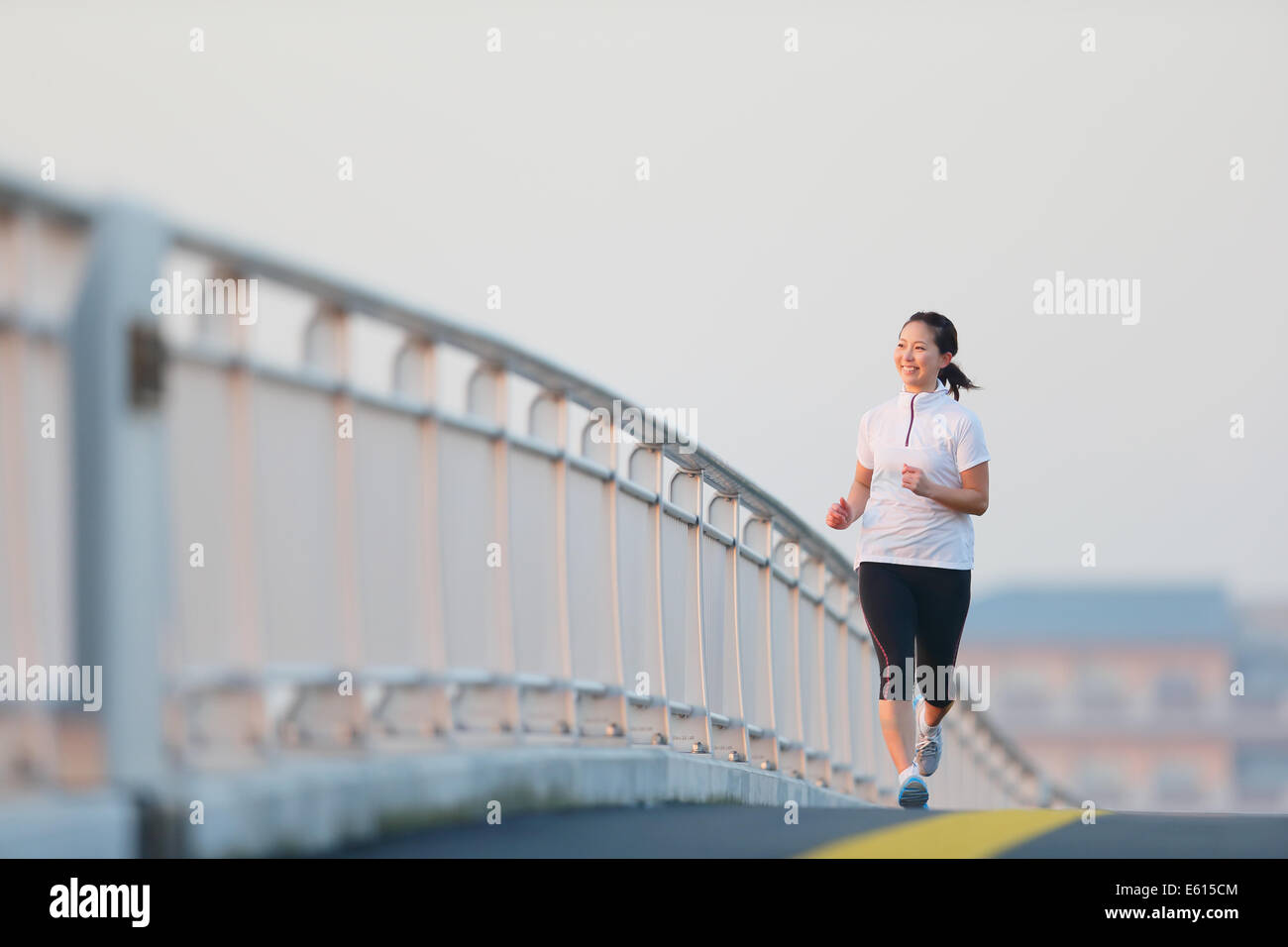 Young Japanese girl jogging Stock Photo - Alamy