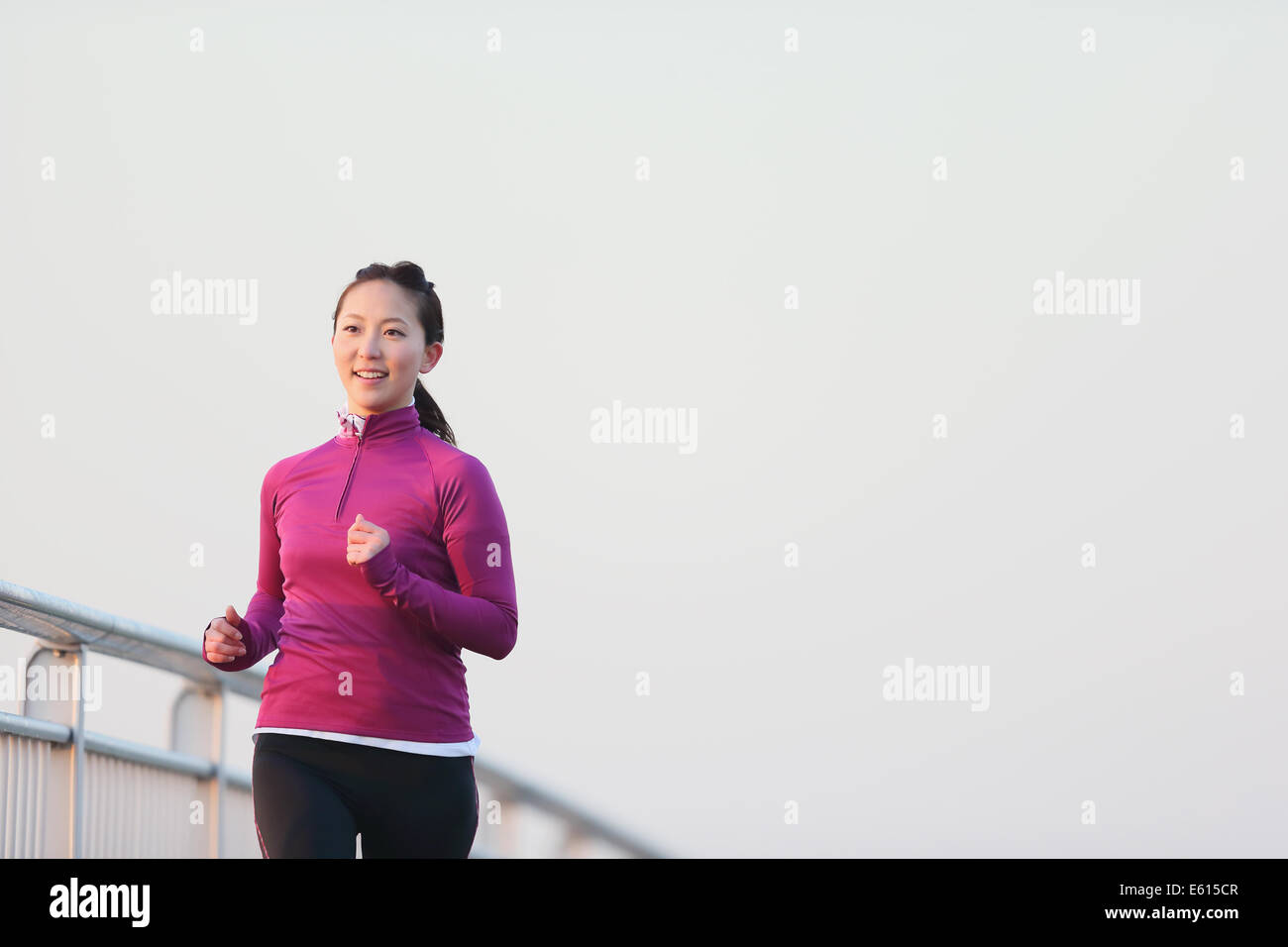 Young Japanese girl jogging Stock Photo - Alamy