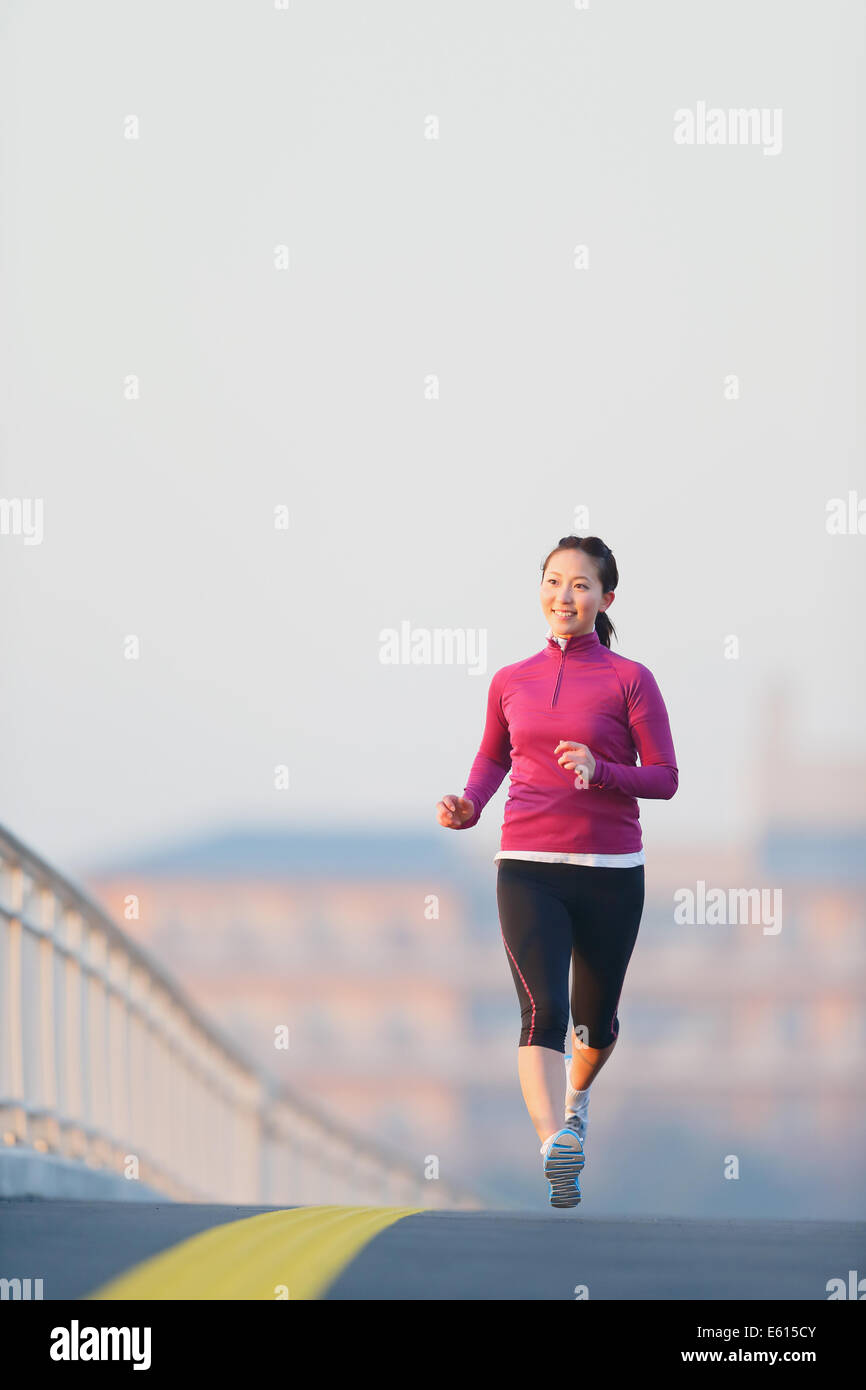 Young Japanese girl jogging Stock Photo - Alamy