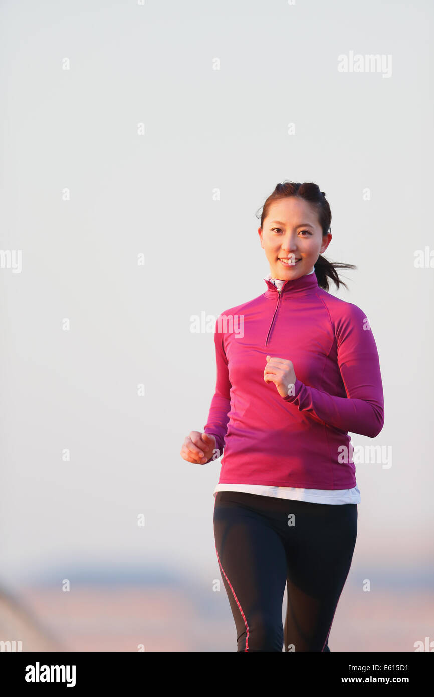 Young Japanese girl jogging Stock Photo - Alamy