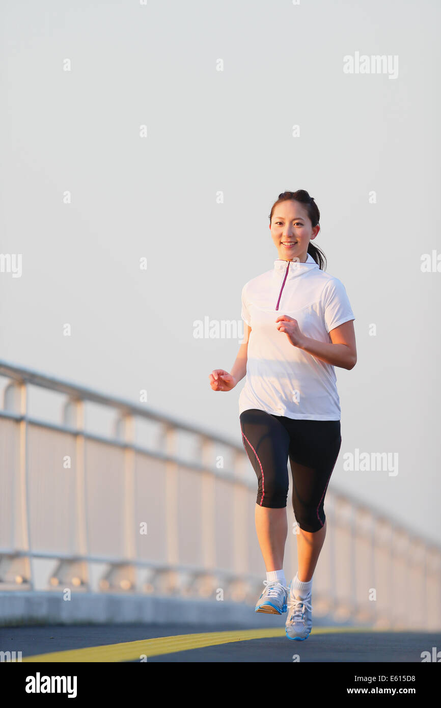 Young Japanese girl jogging Stock Photo - Alamy