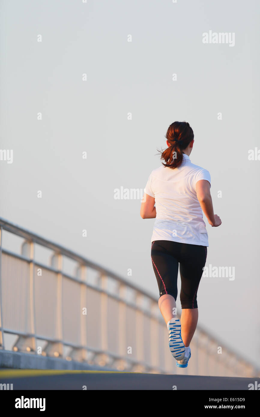 Young Japanese girl jogging Stock Photo - Alamy