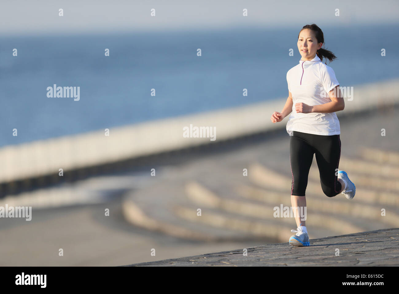 Young Japanese girl jogging Stock Photo - Alamy