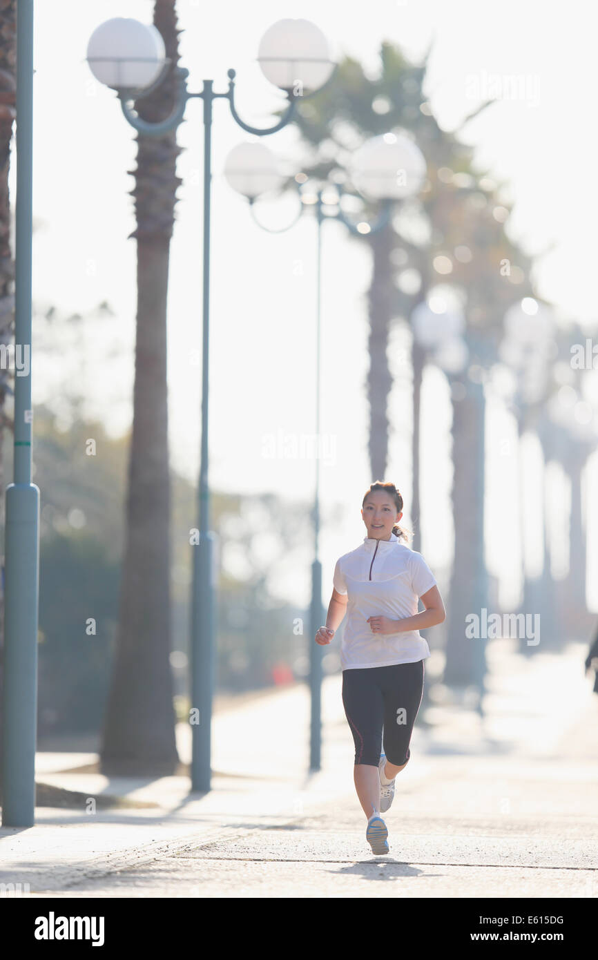 Young Japanese girl jogging Stock Photo - Alamy