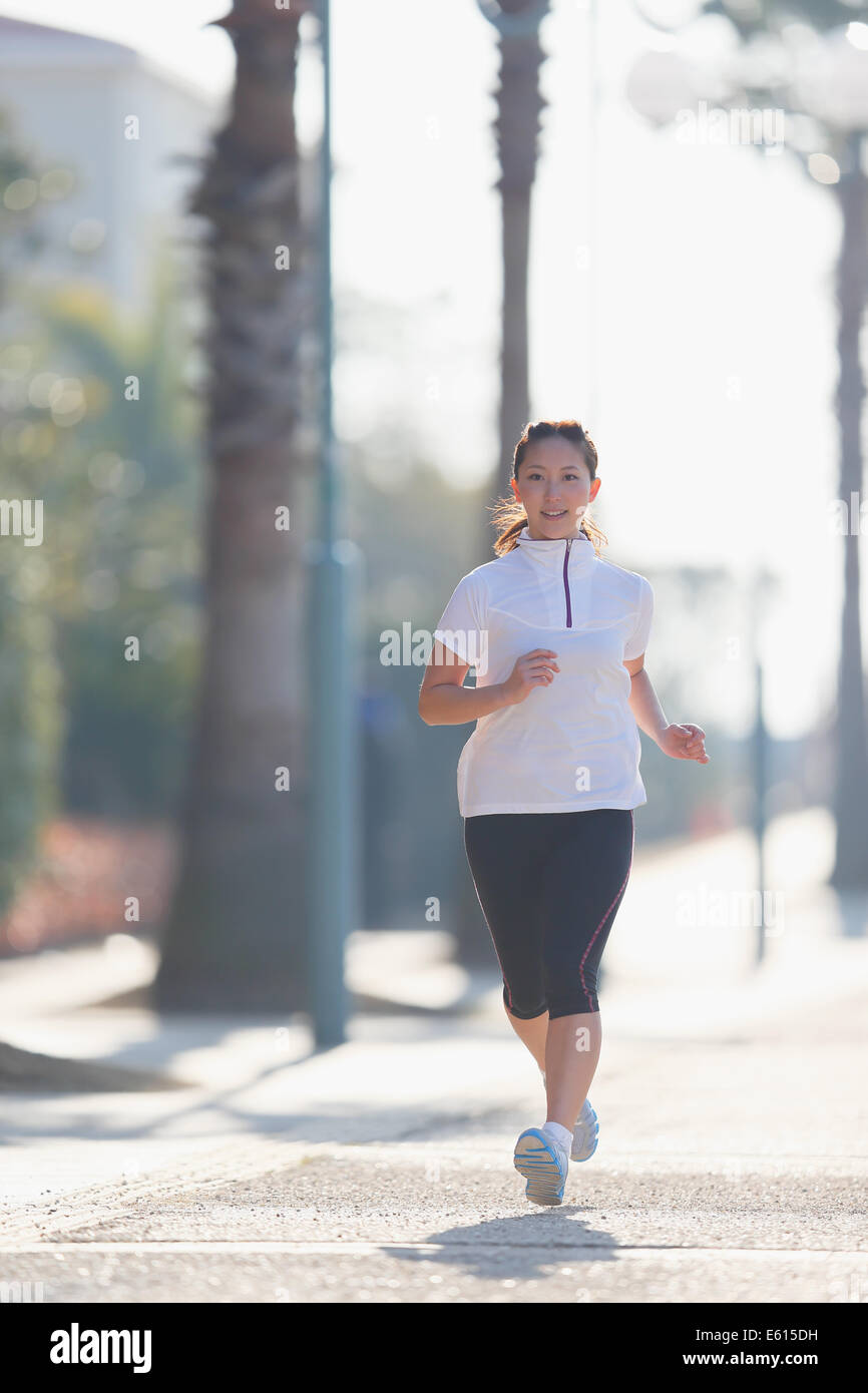 Young Japanese girl jogging Stock Photo - Alamy