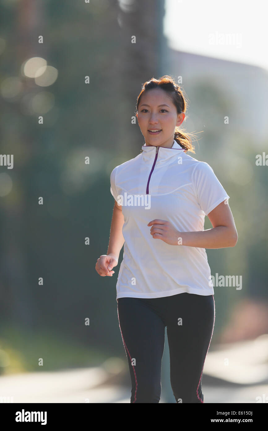 Young Japanese girl jogging Stock Photo - Alamy