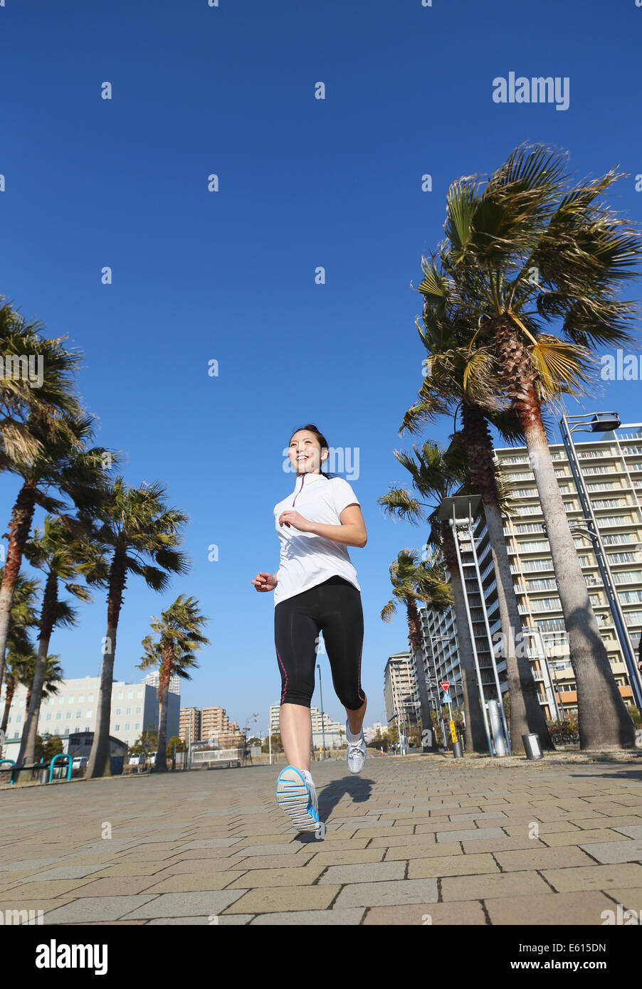 Young Japanese girl jogging Stock Photo - Alamy