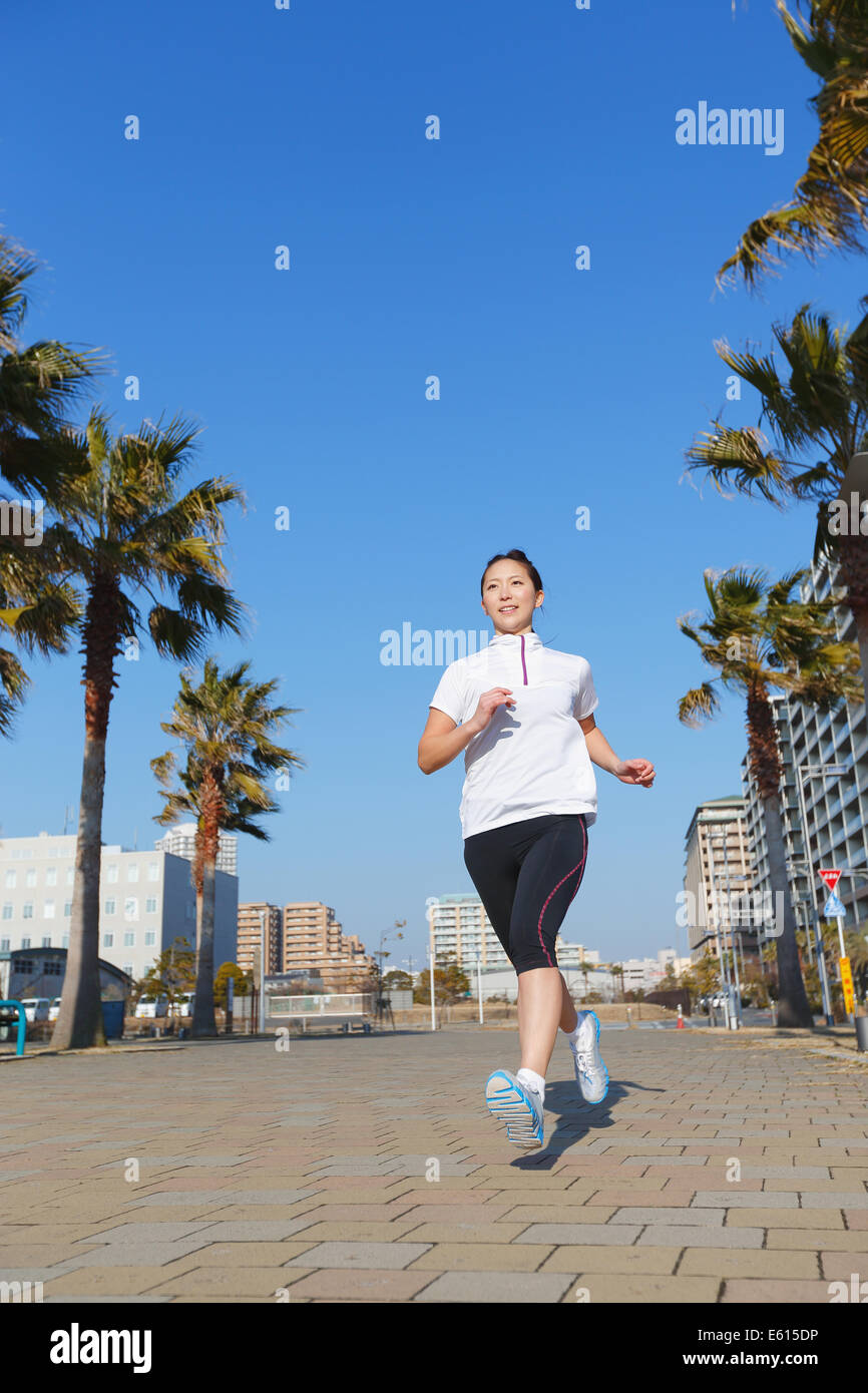 Young Japanese girl jogging Stock Photo - Alamy