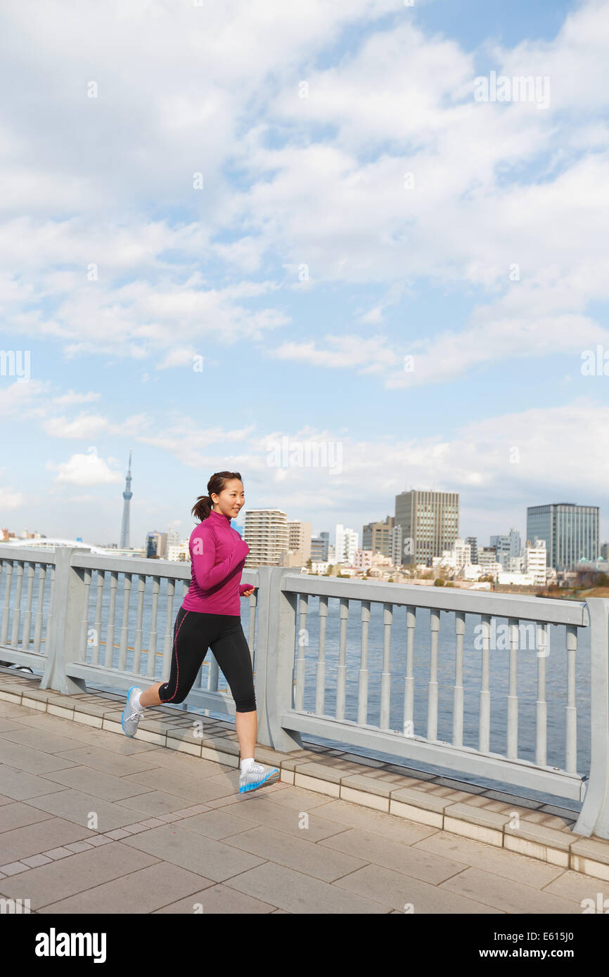 Young Japanese girl jogging Stock Photo - Alamy