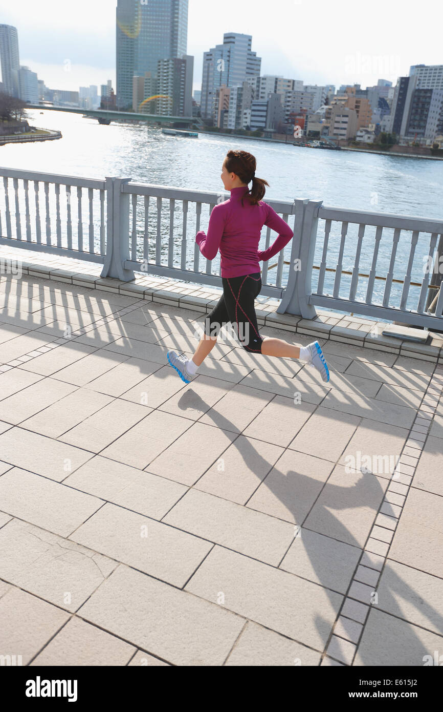 Young Japanese girl jogging Stock Photo - Alamy