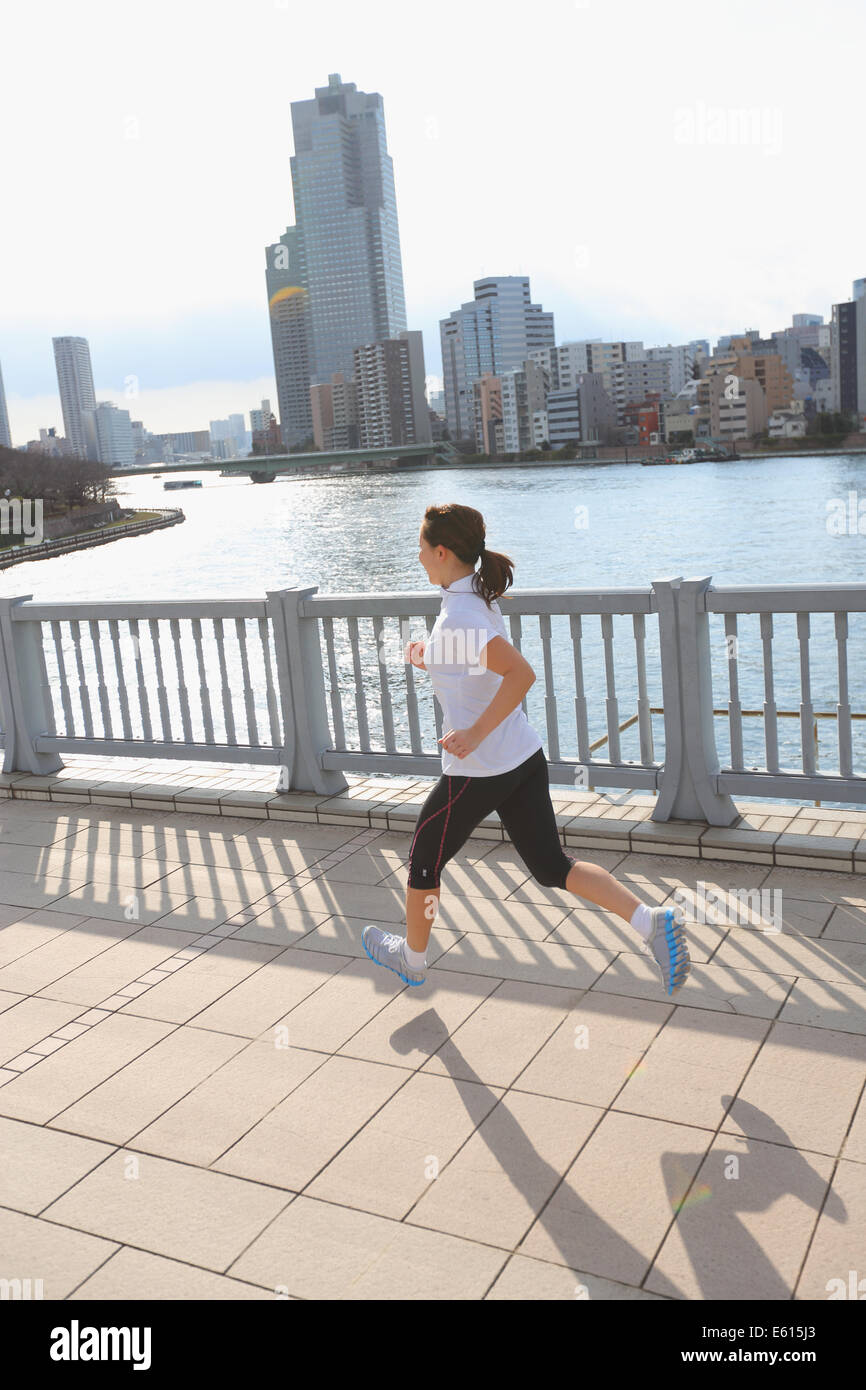Young Japanese girl jogging Stock Photo - Alamy