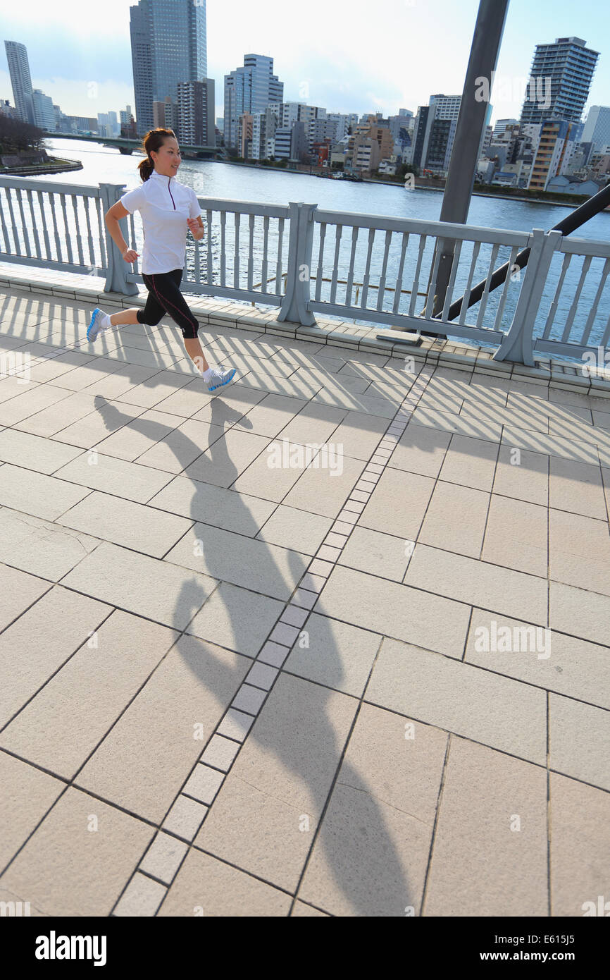 Young Japanese girl jogging Stock Photo - Alamy