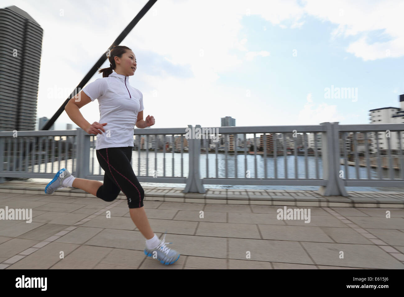 Young Japanese girl jogging Stock Photo - Alamy