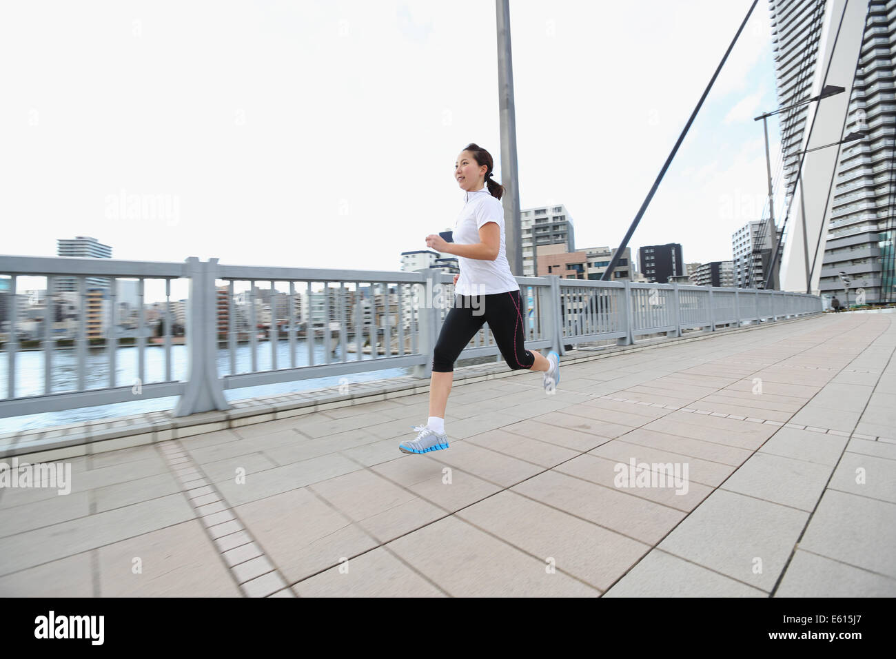 Young Japanese girl jogging Stock Photo - Alamy
