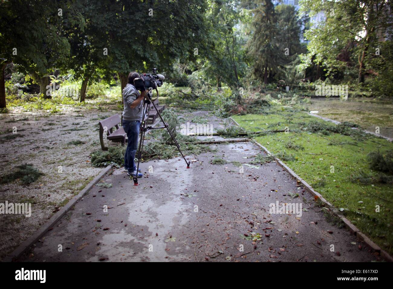 Bad Schwalbach, Germany. 11th Aug, 2014. A cameraman films the spa park ...