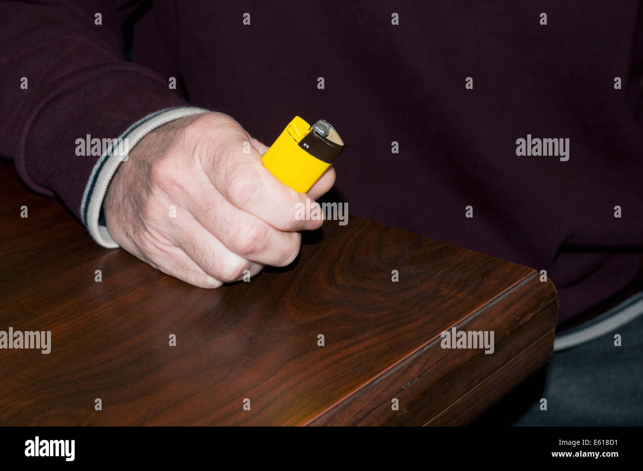 Man holding lighter Stock Photo - Alamy