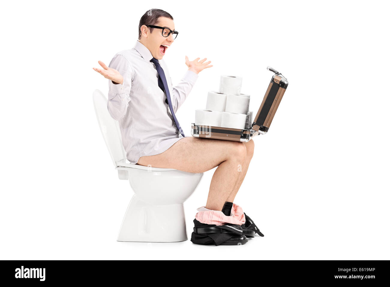 Overjoyed man holding a briefcase full of toilet paper seated on a ...