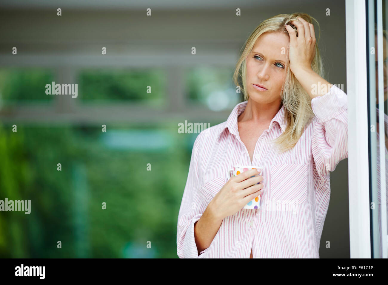 Concerned looking woman Stock Photo - Alamy