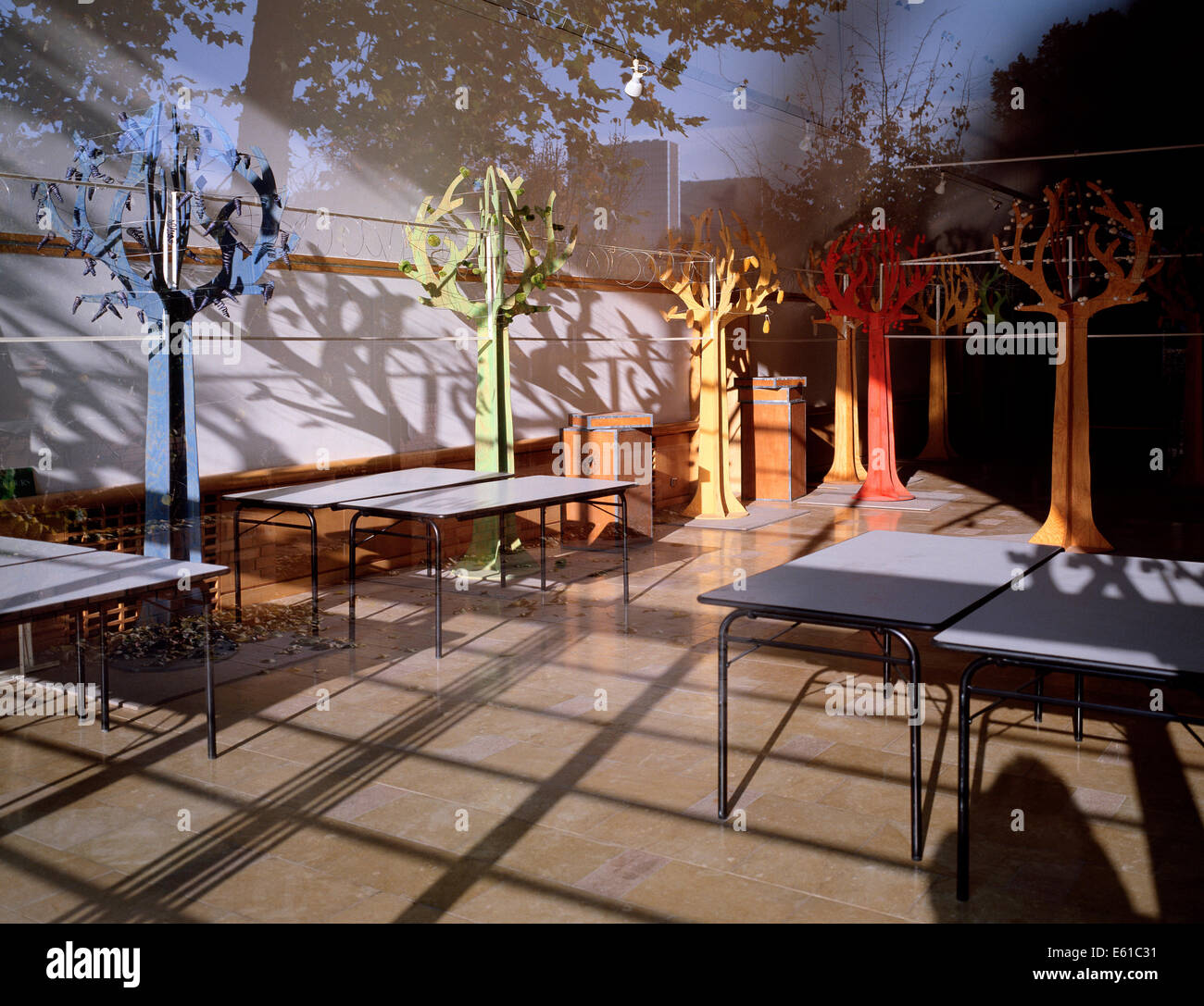 Window of community hall with colorful artificial trees inside Stock ...