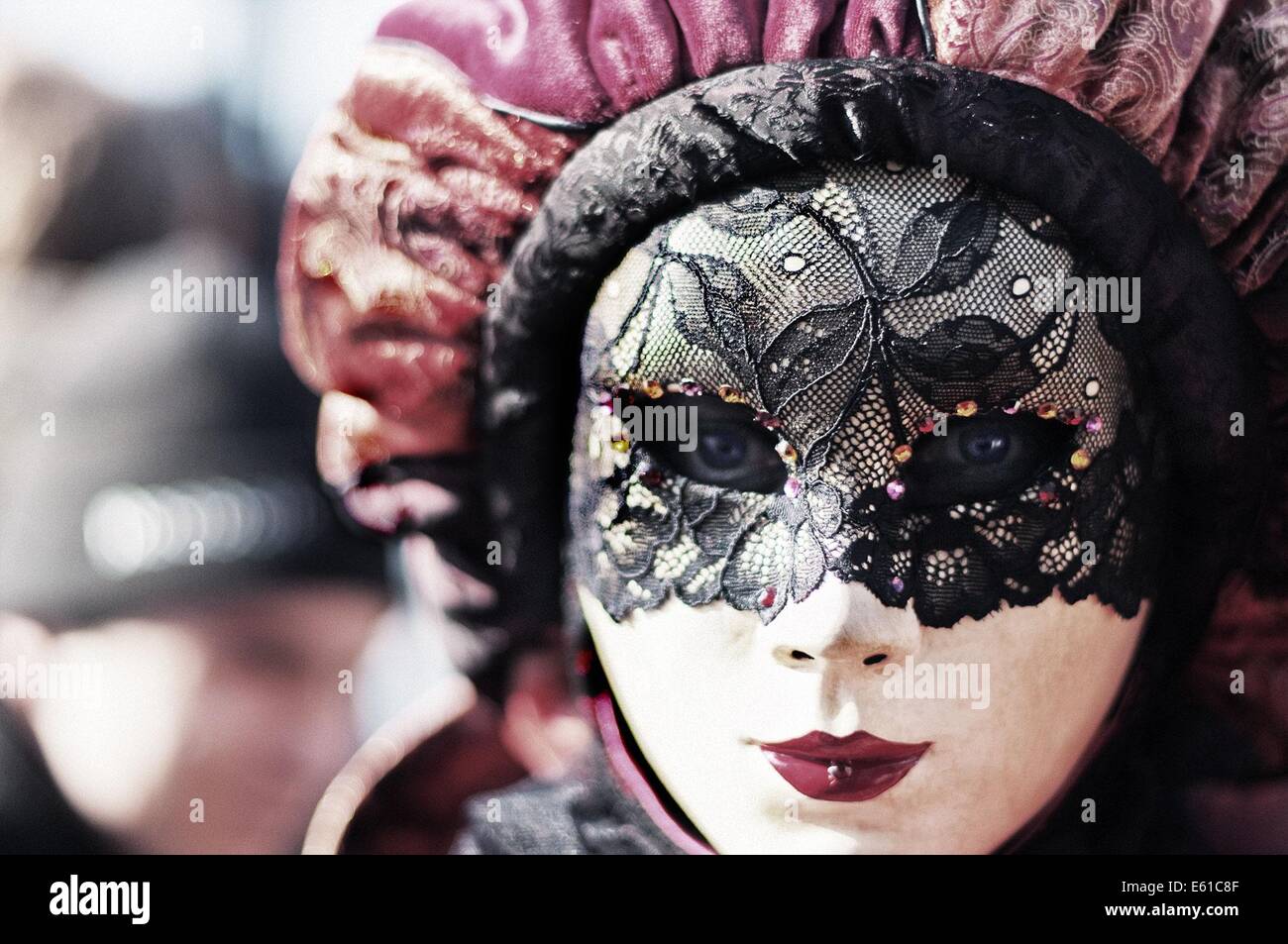 A woman wearing an elaborate carnival mask, designed for the Carnival ...