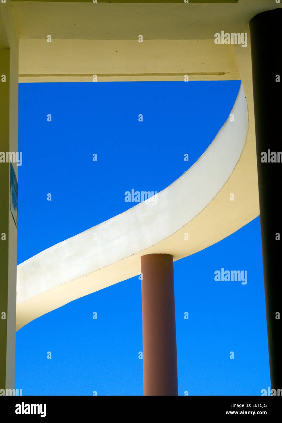 Curved building and columns against blue sky, Kos, Greece Stock Photo ...