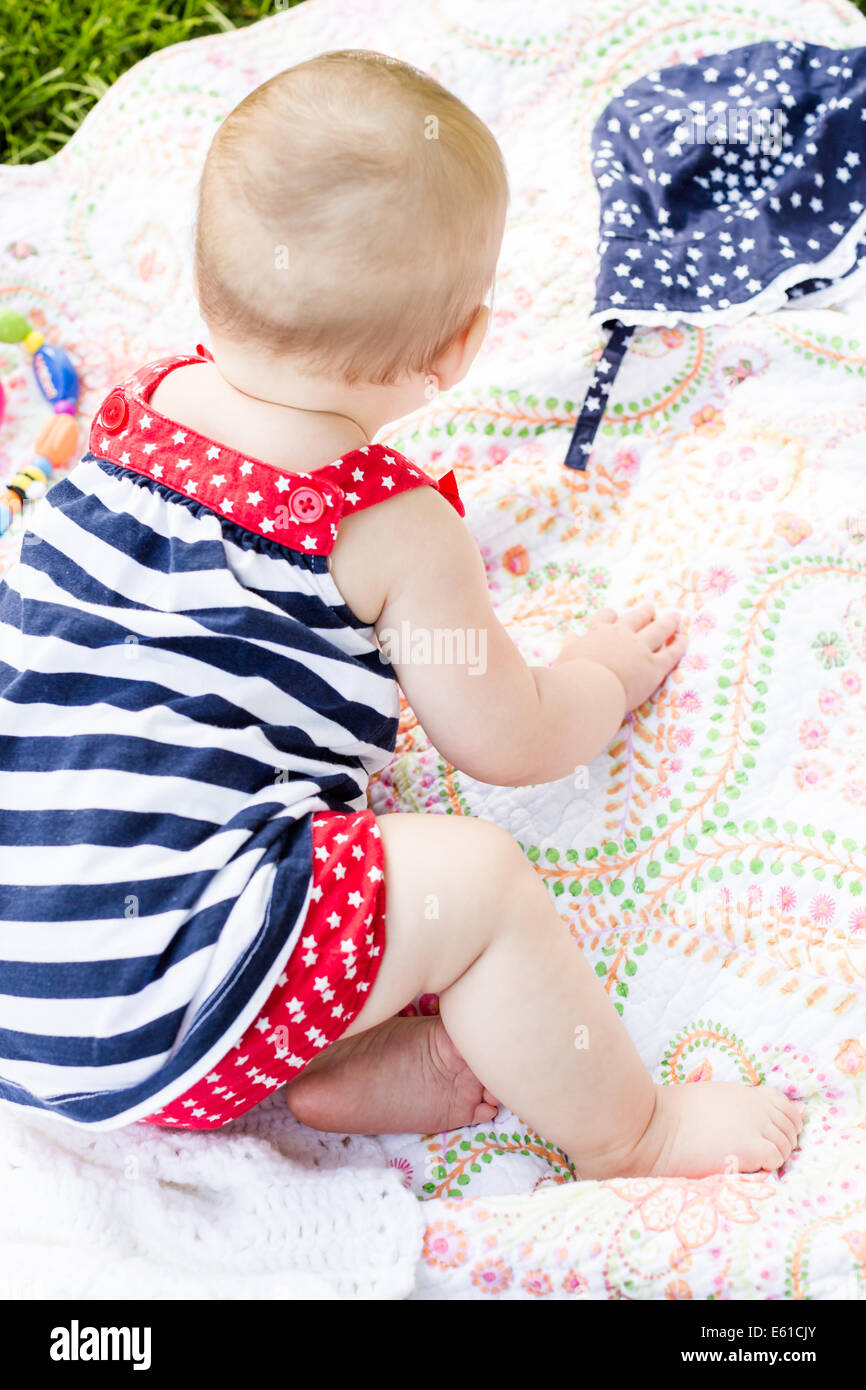 Cute baby girl celebrating 4th of July in the park Stock Photo - Alamy