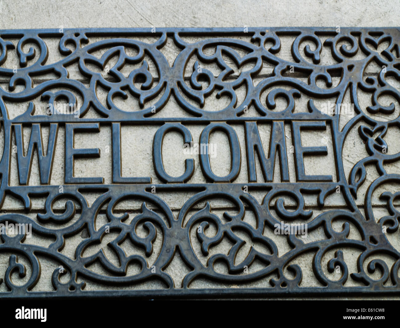 black wrought iron welcome rug in nature Stock Photo - Alamy