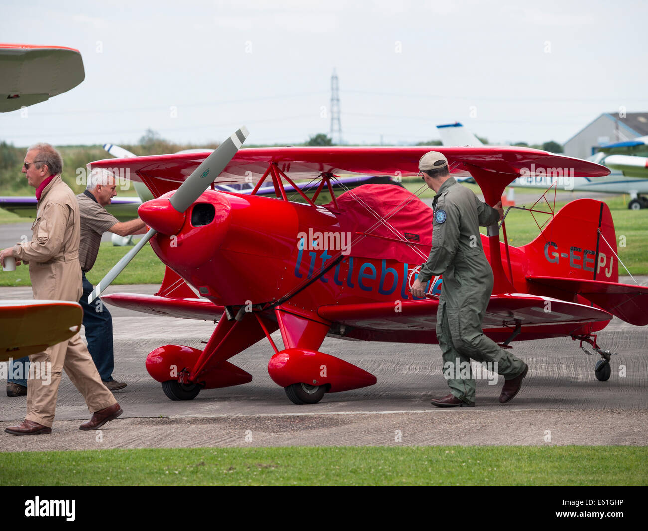 pilots push a Pitts Special aerobatic biplane aircraft at Breighton ...