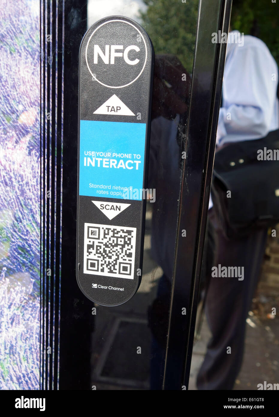 QR code for smartphones next to bus shelter advertisement, London Stock ...