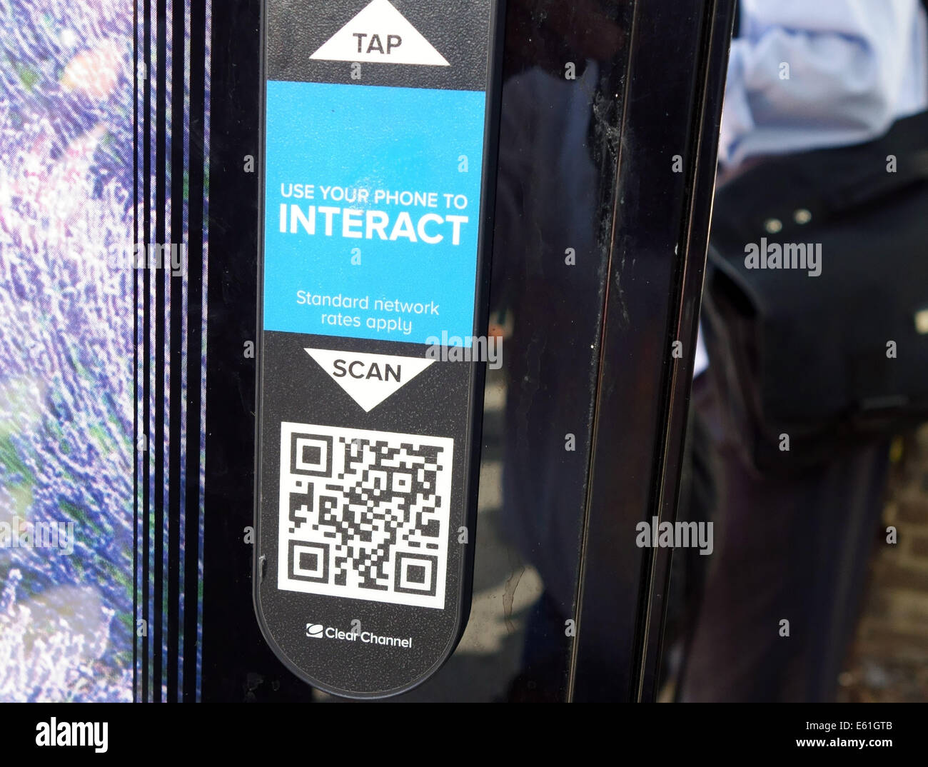 QR code for smartphones next to bus shelter advertisement, London Stock ...