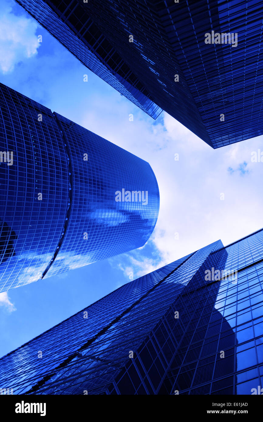 Modern skyscrapers close-up toned in blue color Stock Photo - Alamy