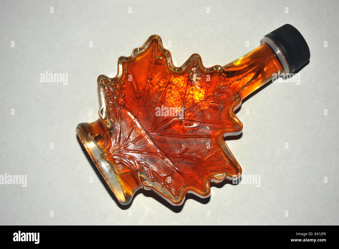 A Canadian maple syrup bottle in the shape of a maple leaf Stock Photo ...