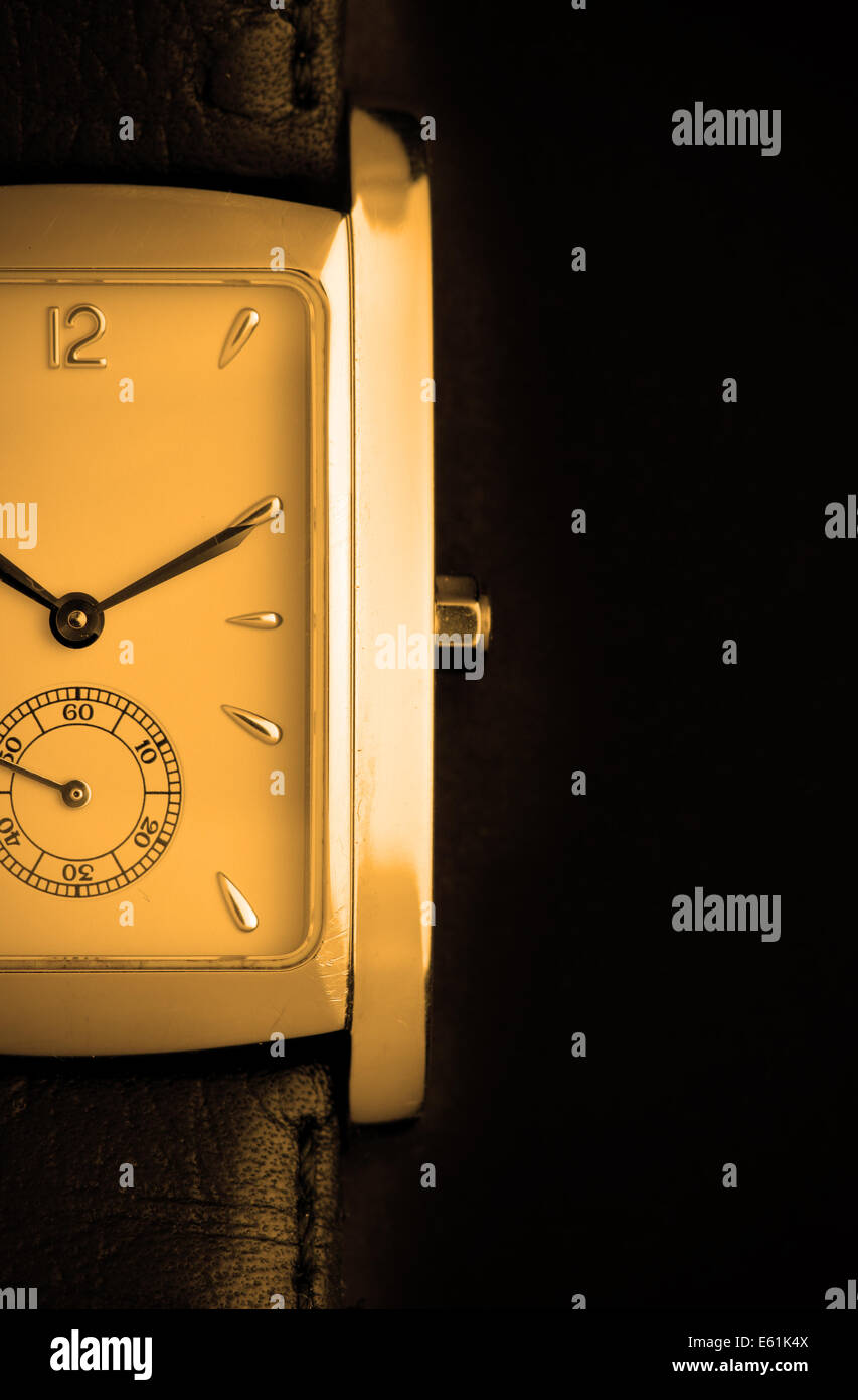 Face of watch close-up over black background Stock Photo - Alamy
