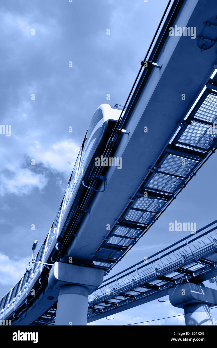High speed monorail train on overpass toned in blue color Stock Photo ...