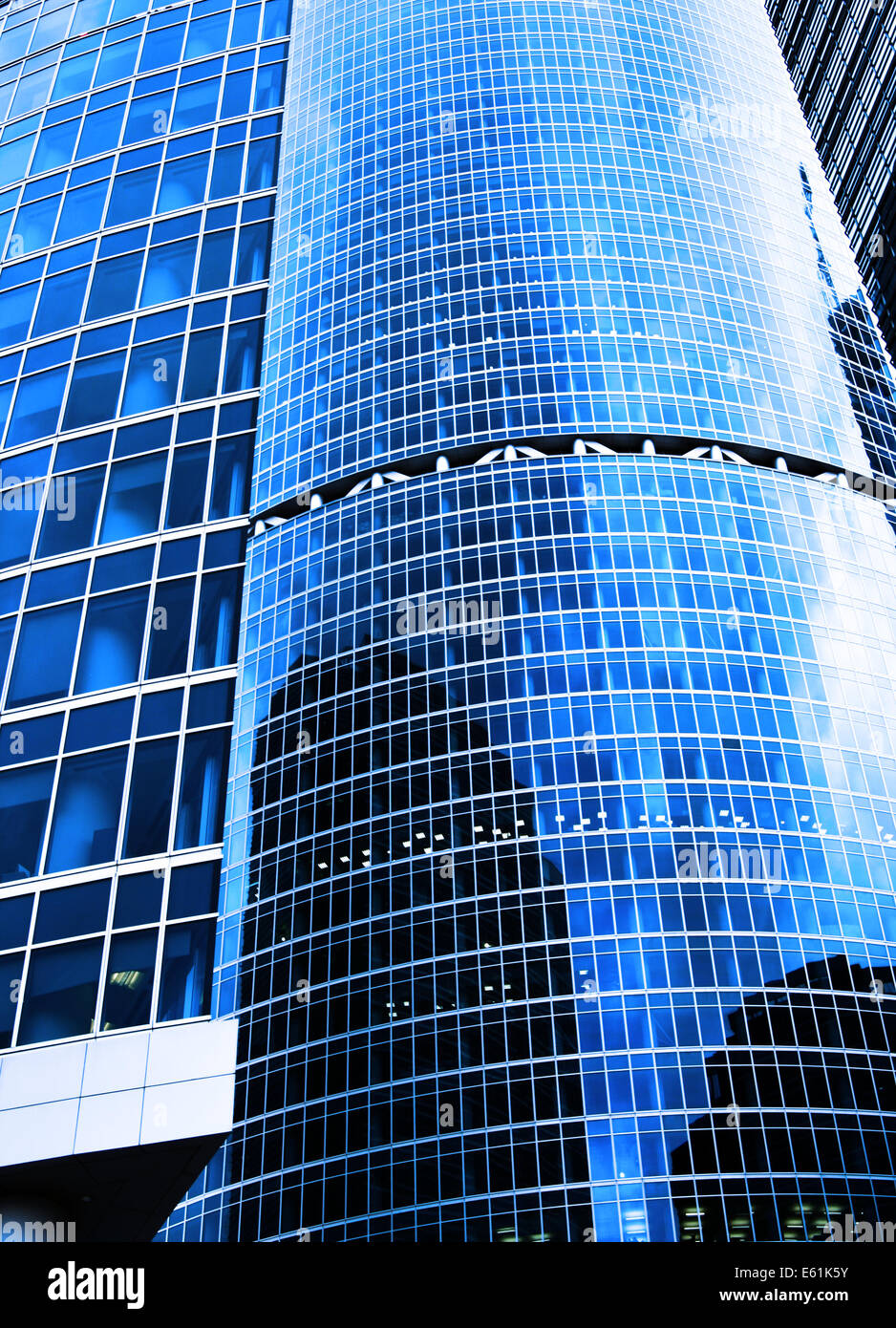 Modern skyscrapers close-up toned in blue color Stock Photo - Alamy
