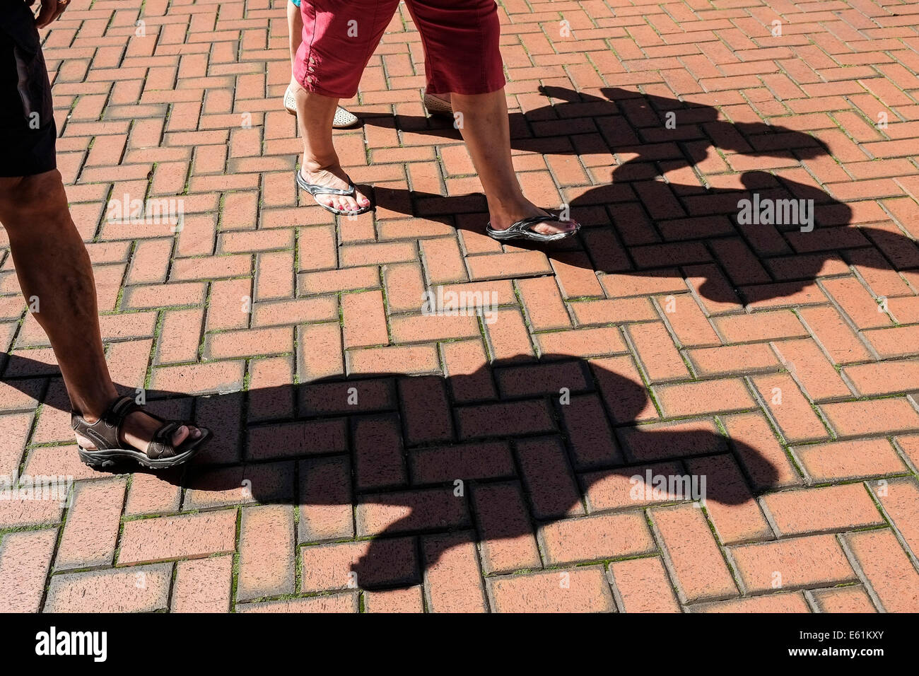 Shadows cast by people walking Stock Photo - Alamy