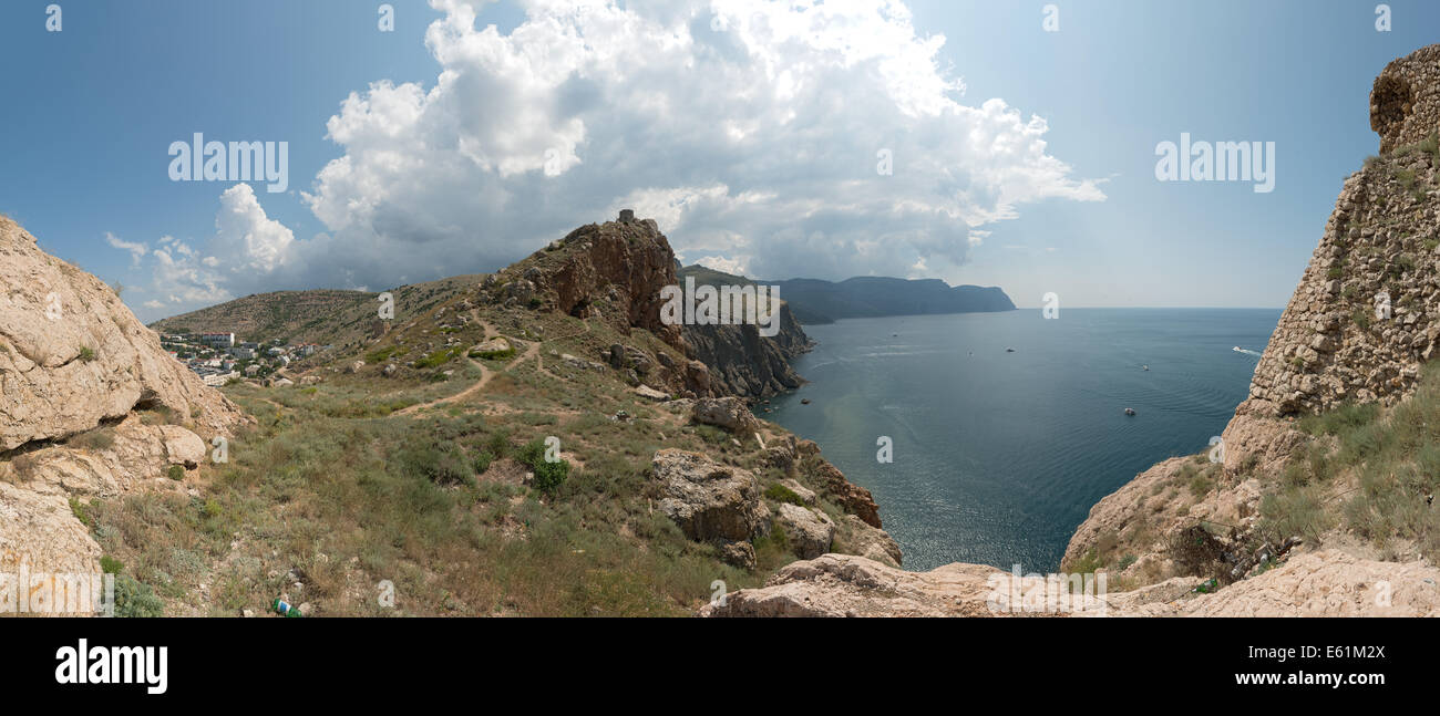 View of coastline with Genoese fortress on cliff top from the entrance ...