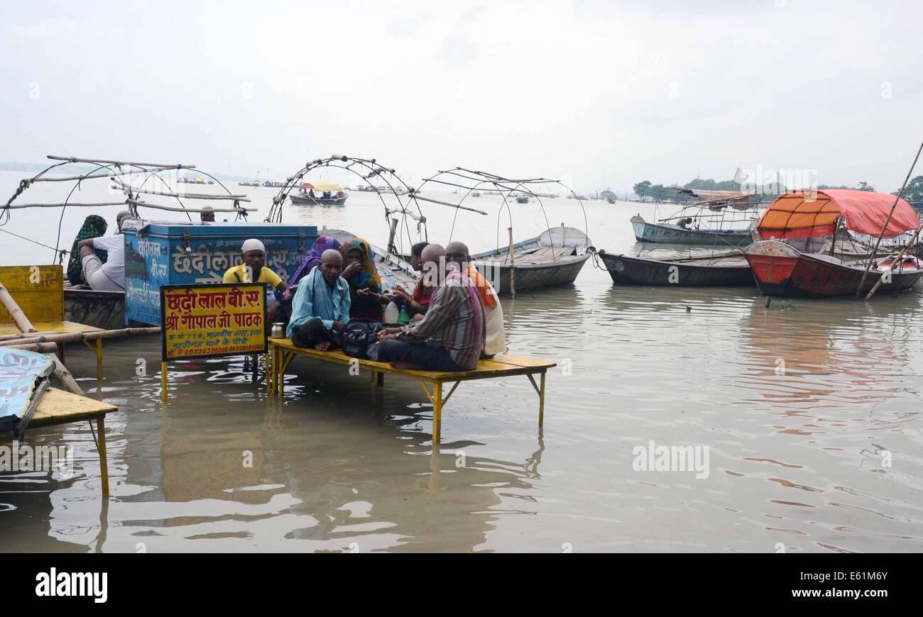 Allahabad, India. 11th Aug, 2014. Devotees perform rituals at a ...