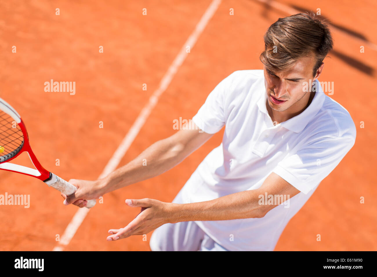 Young man playing tennis Stock Photo - Alamy