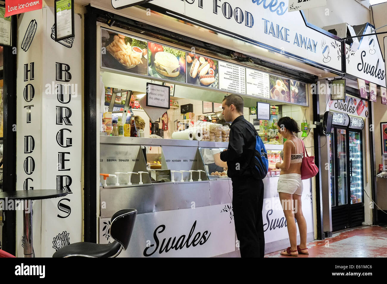 Customers buying food from a fast food outlet in Chelmsford market ...