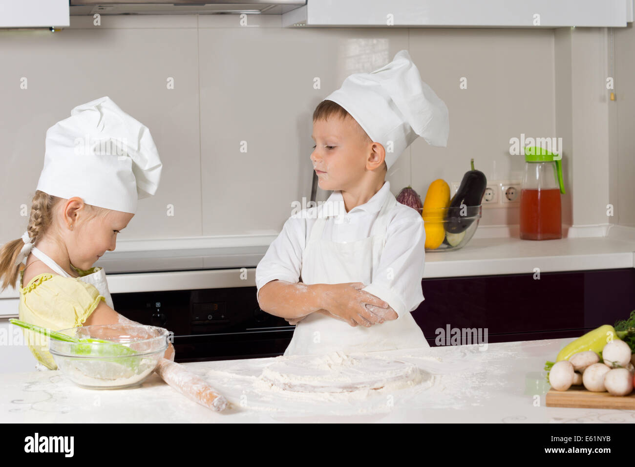 Two Young Cute Chefs Role Playing at the Home Kitchen Stock Photo - Alamy