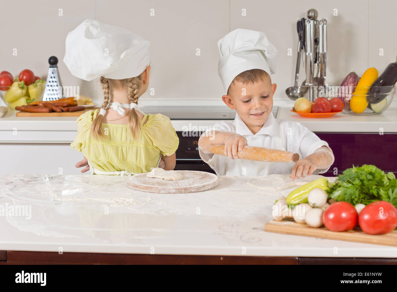 Two Very Young Chefs Making Food to Eat While Talking at the Kitchen ...