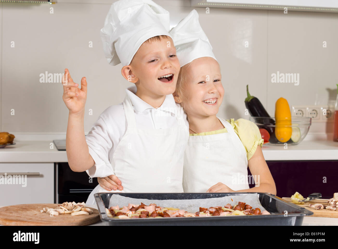 Very Happy Little Chefs After Baking Pizza in the Kitchen Stock Photo ...