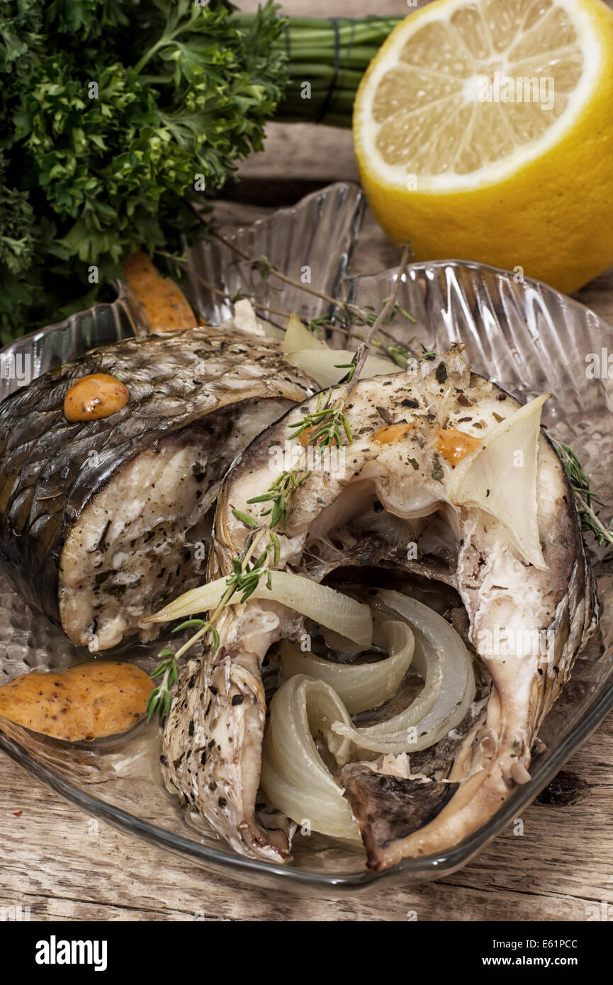 piece of fragrant roasted fish in sauce and spices Stock Photo - Alamy