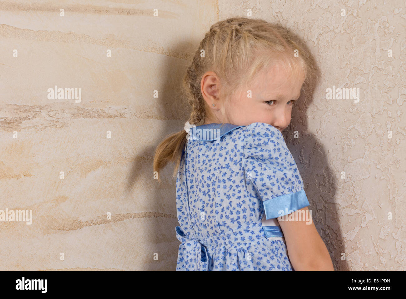 Child standing corner facing wall hi-res stock photography and images ...