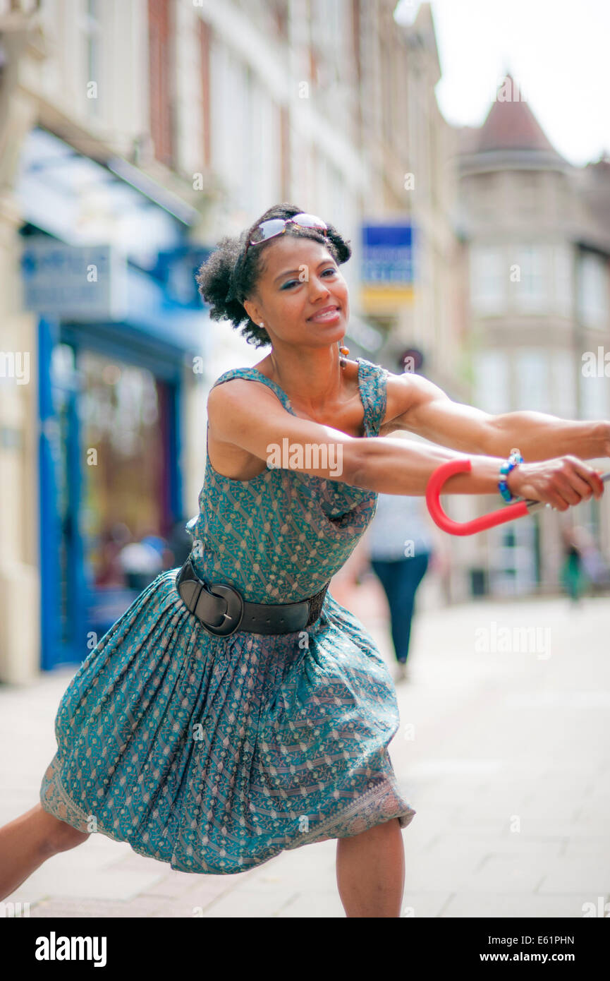 Happy dancer with red umbrella Stock Photo - Alamy