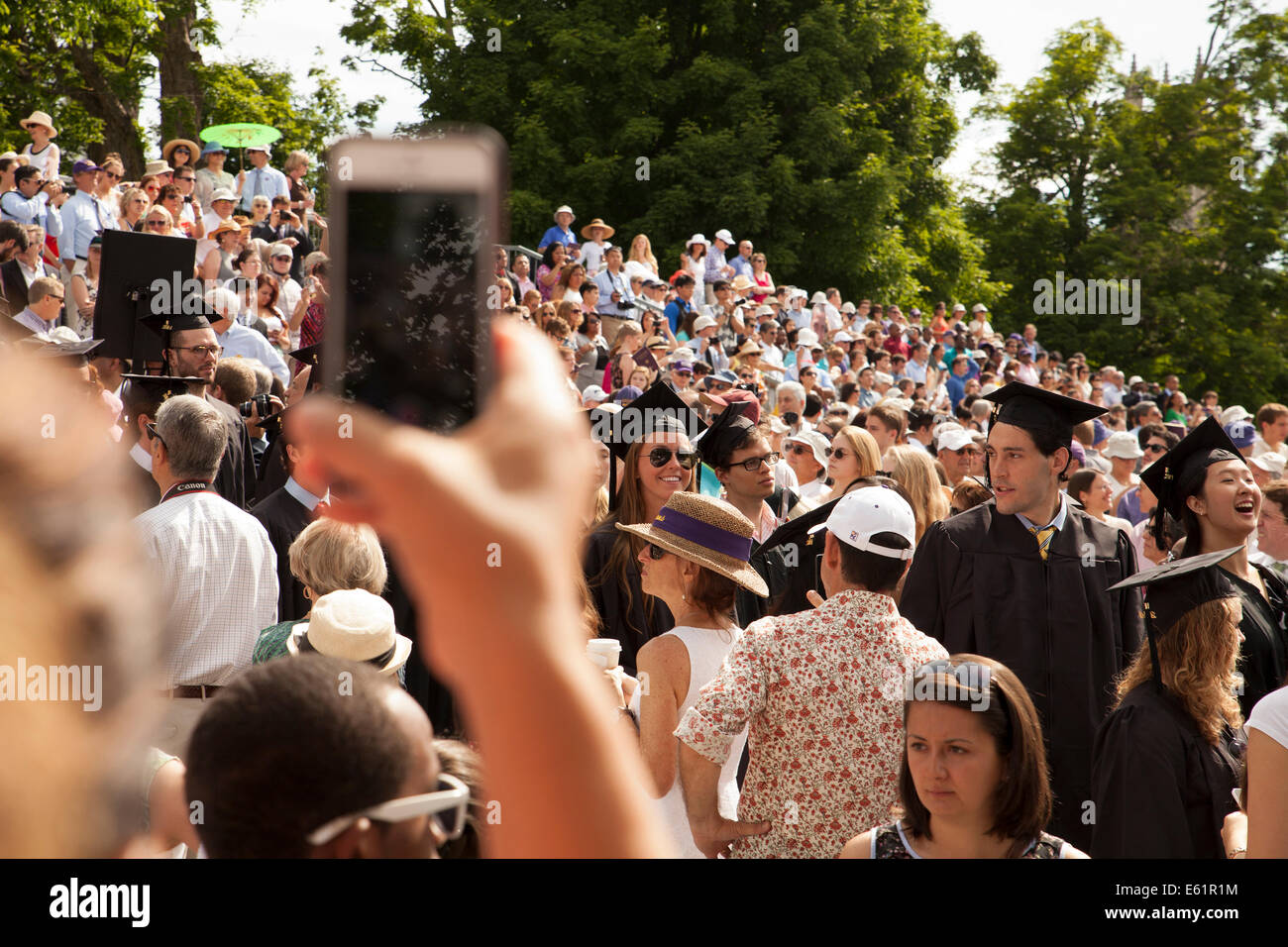 Graduating students parade into the seating area before their ...