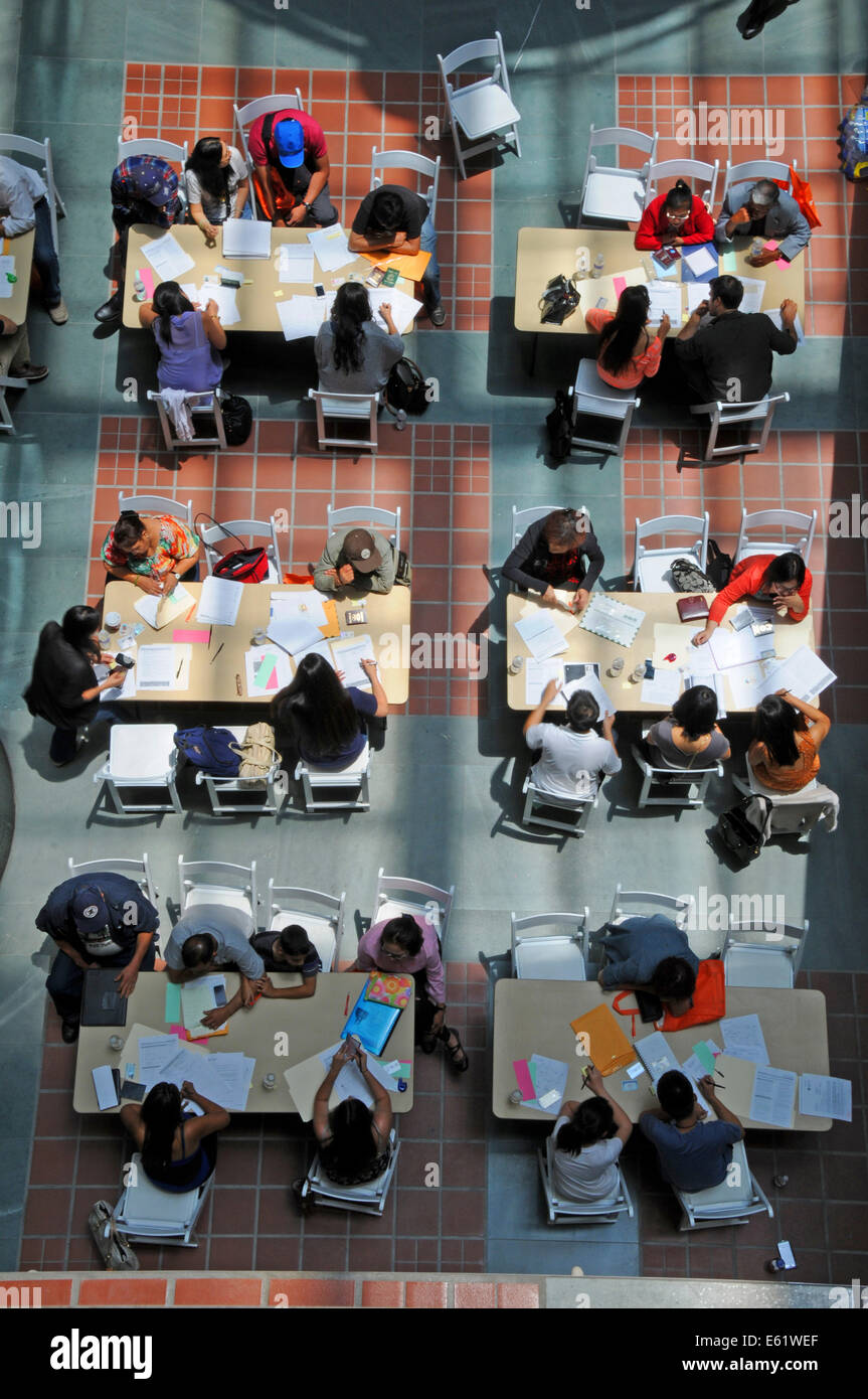Students taking written test at Los Angeles Central Library Stock Photo ...