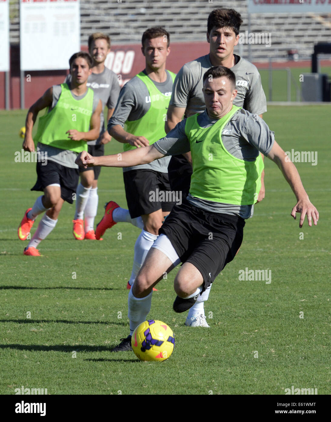 Usa. 10th Aug, 2014. SPORTS -- UNM soccer player Josh Goss races for ...
