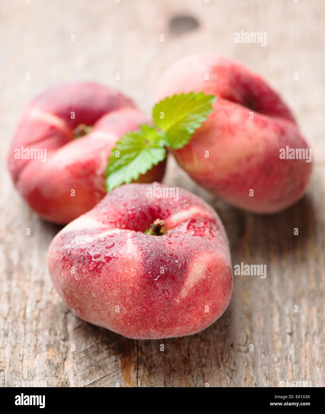 Ripe juicy chinese flat peaches (also called Saturn peaches Stock Photo ...